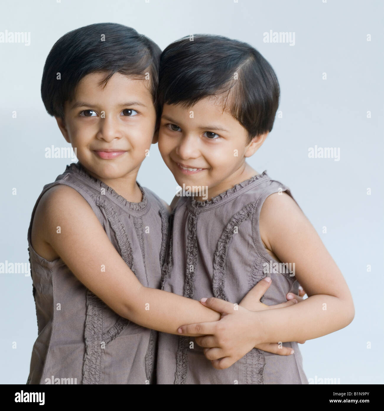 Close-up of two girls hugging each other Stock Photo - Alamy