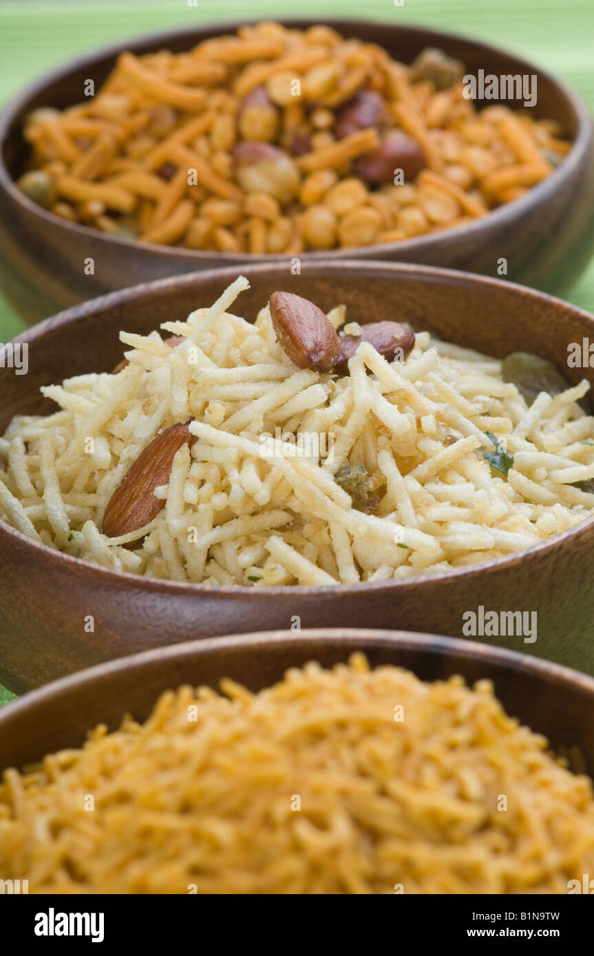 Close-up of various type of snacks in bowls Stock Photo - Alamy