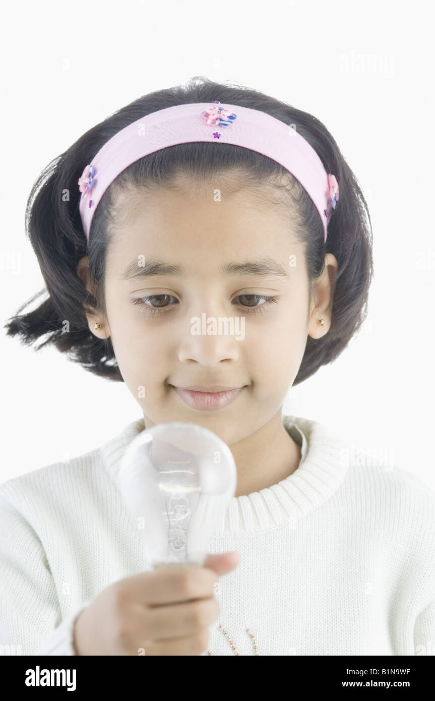 Child holding a light bulb hi-res stock photography and images - Alamy