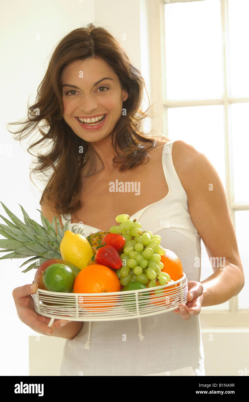 Woman with fruit Stock Photo - Alamy