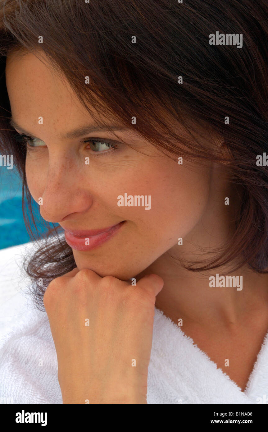 Woman put chin on her hand Stock Photo - Alamy