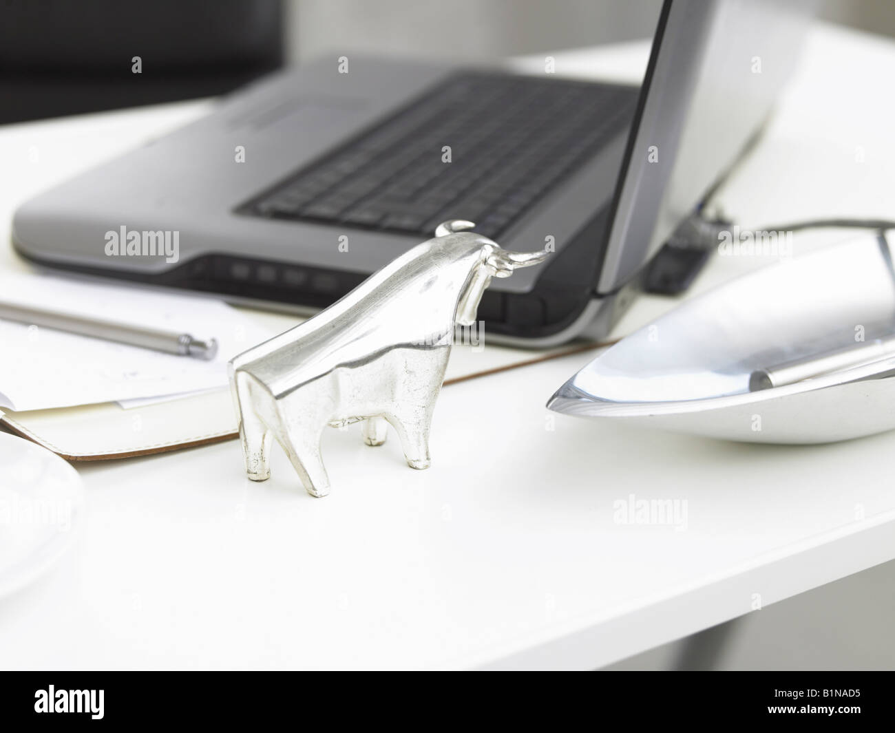 Glass bull on a desk Stock Photo - Alamy