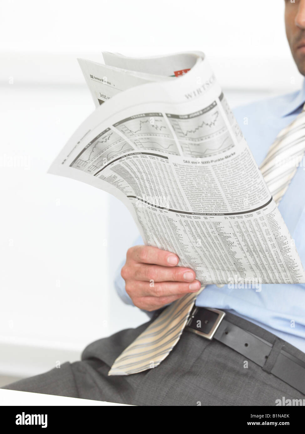 Man is reading the newspaper Stock Photo - Alamy