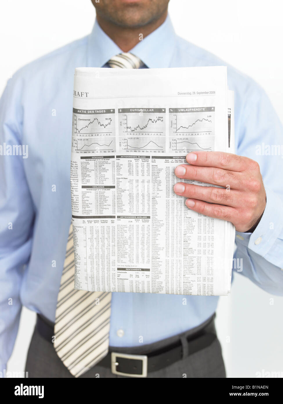 Man showing quotations in newspaper Stock Photo - Alamy