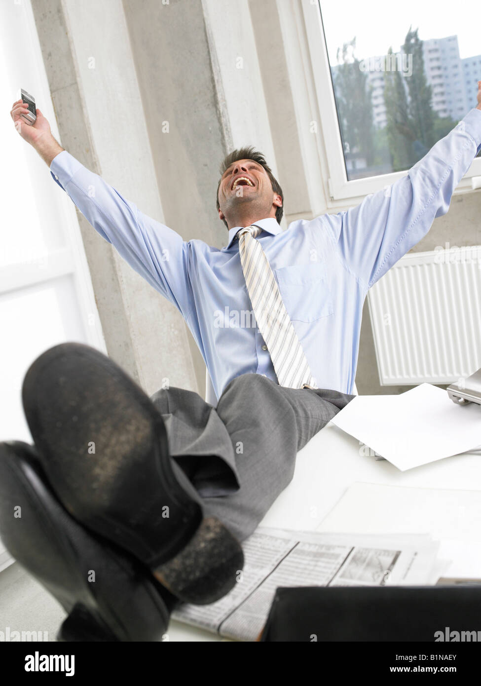 Jubilating business man Stock Photo - Alamy