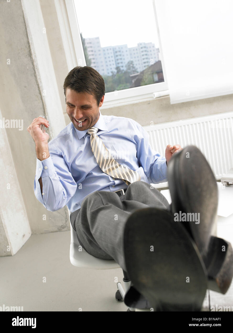 Jubilating business man Stock Photo - Alamy