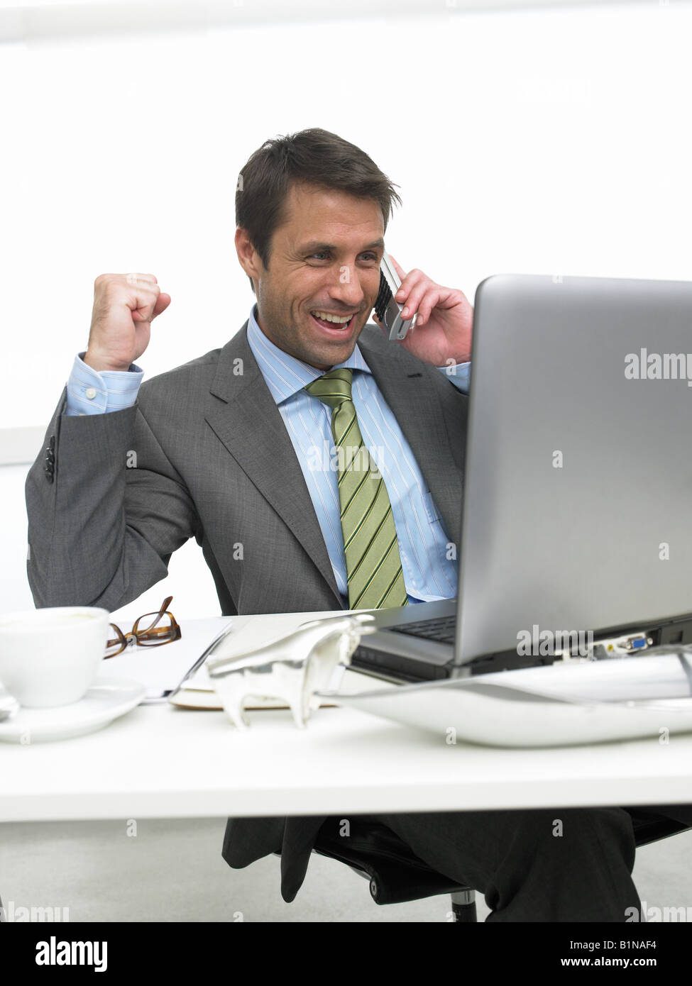 Jubilating business man Stock Photo - Alamy