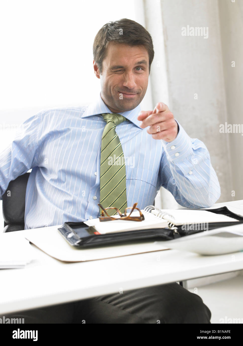Business man is pointing with his finger Stock Photo - Alamy
