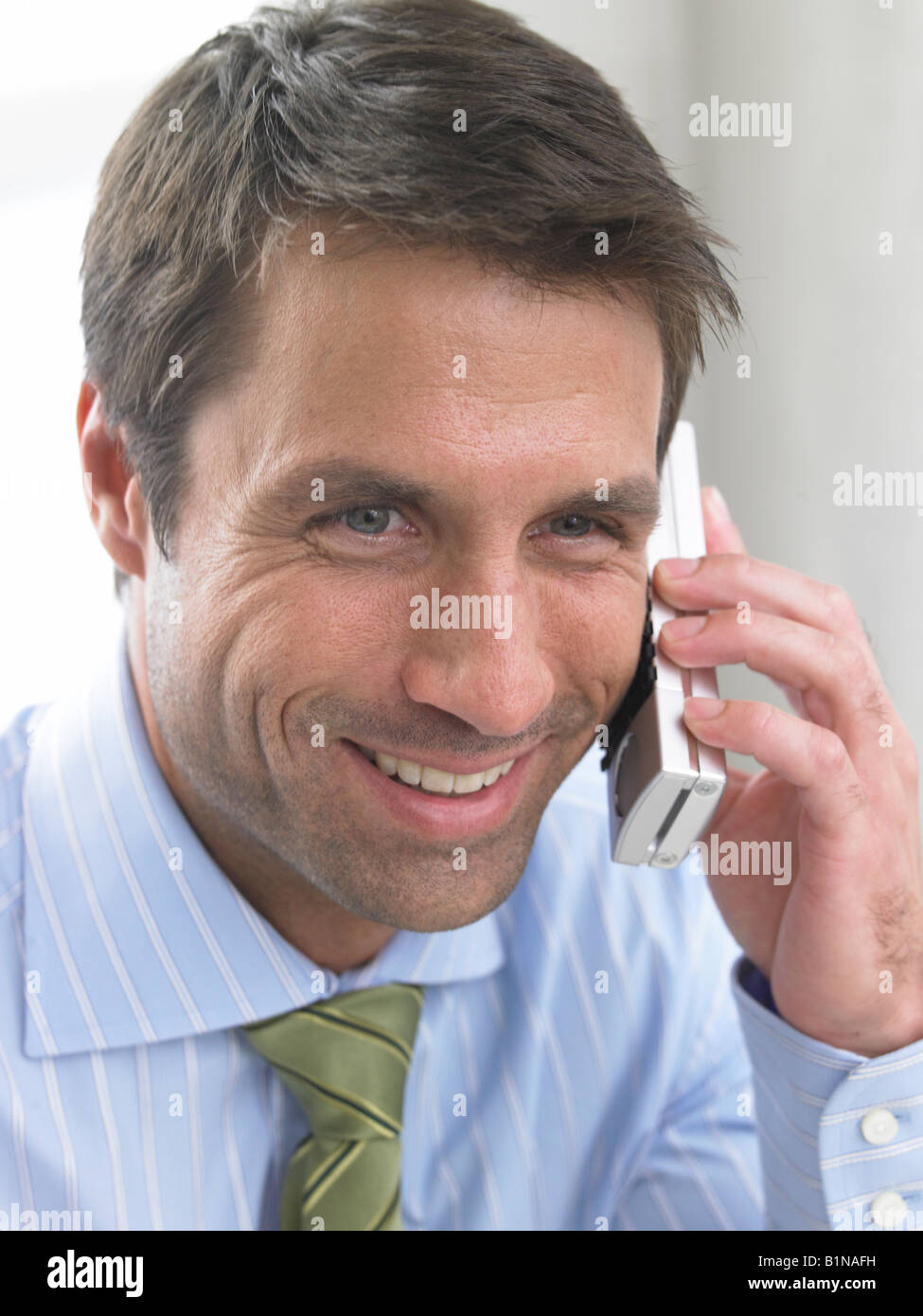 Telephoning business man Stock Photo - Alamy