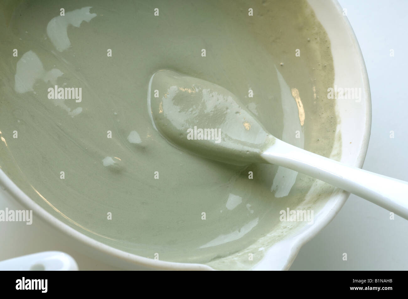 Mixing green clay Stock Photo - Alamy