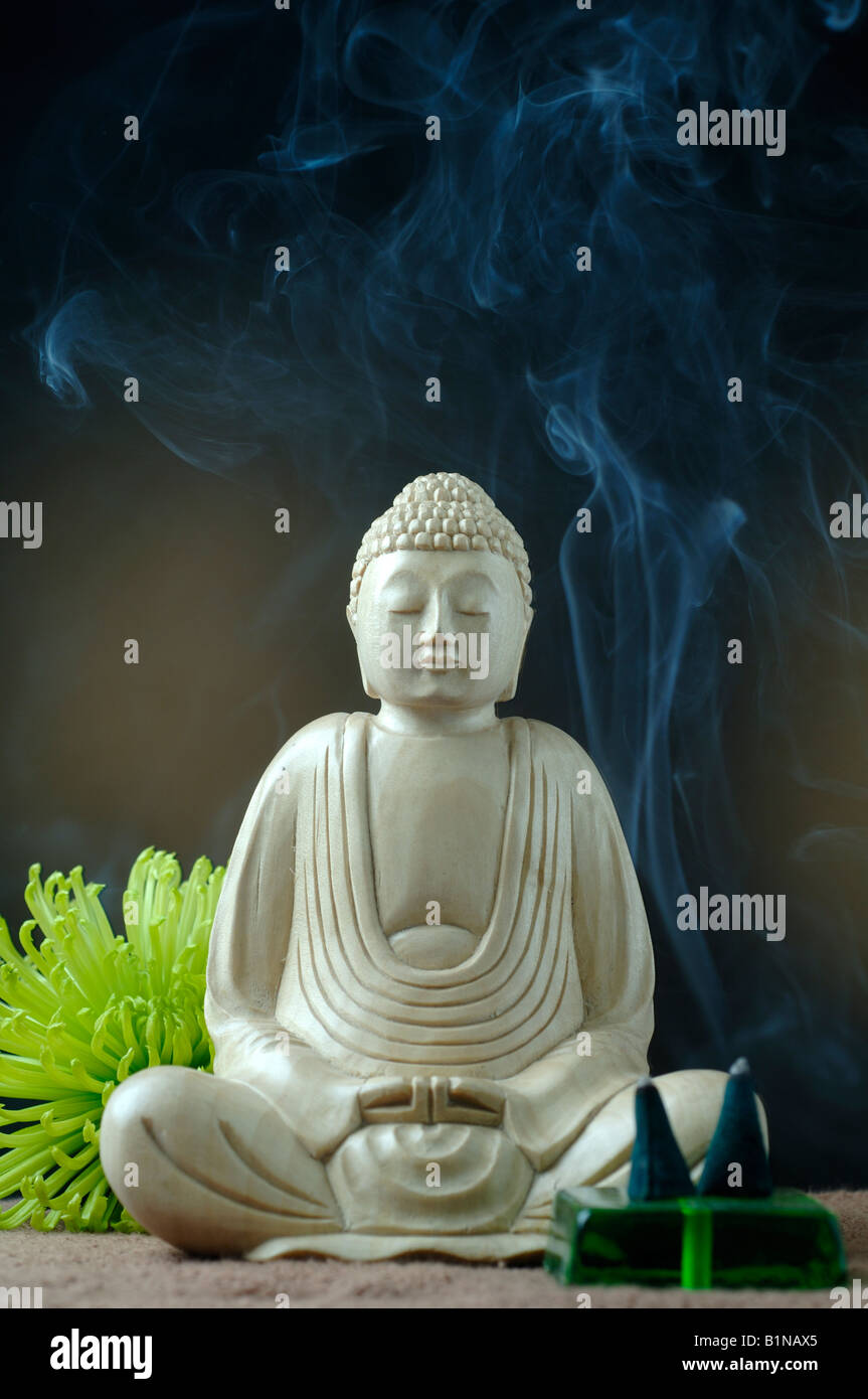 Buddha with joss sticks Stock Photo - Alamy