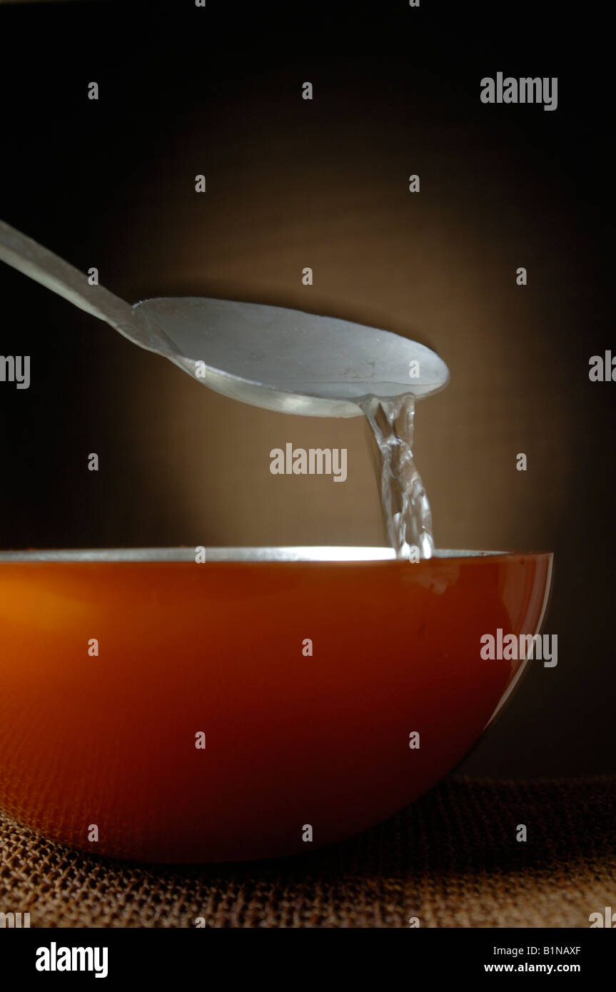 A bowl and a spoon Stock Photo - Alamy
