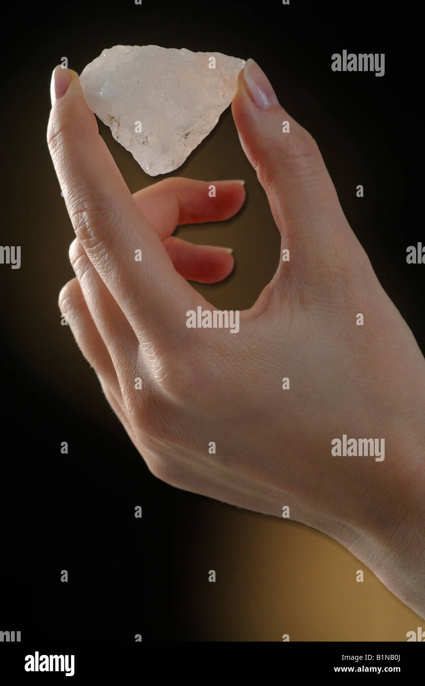 Hand is holding a crystal Stock Photo - Alamy