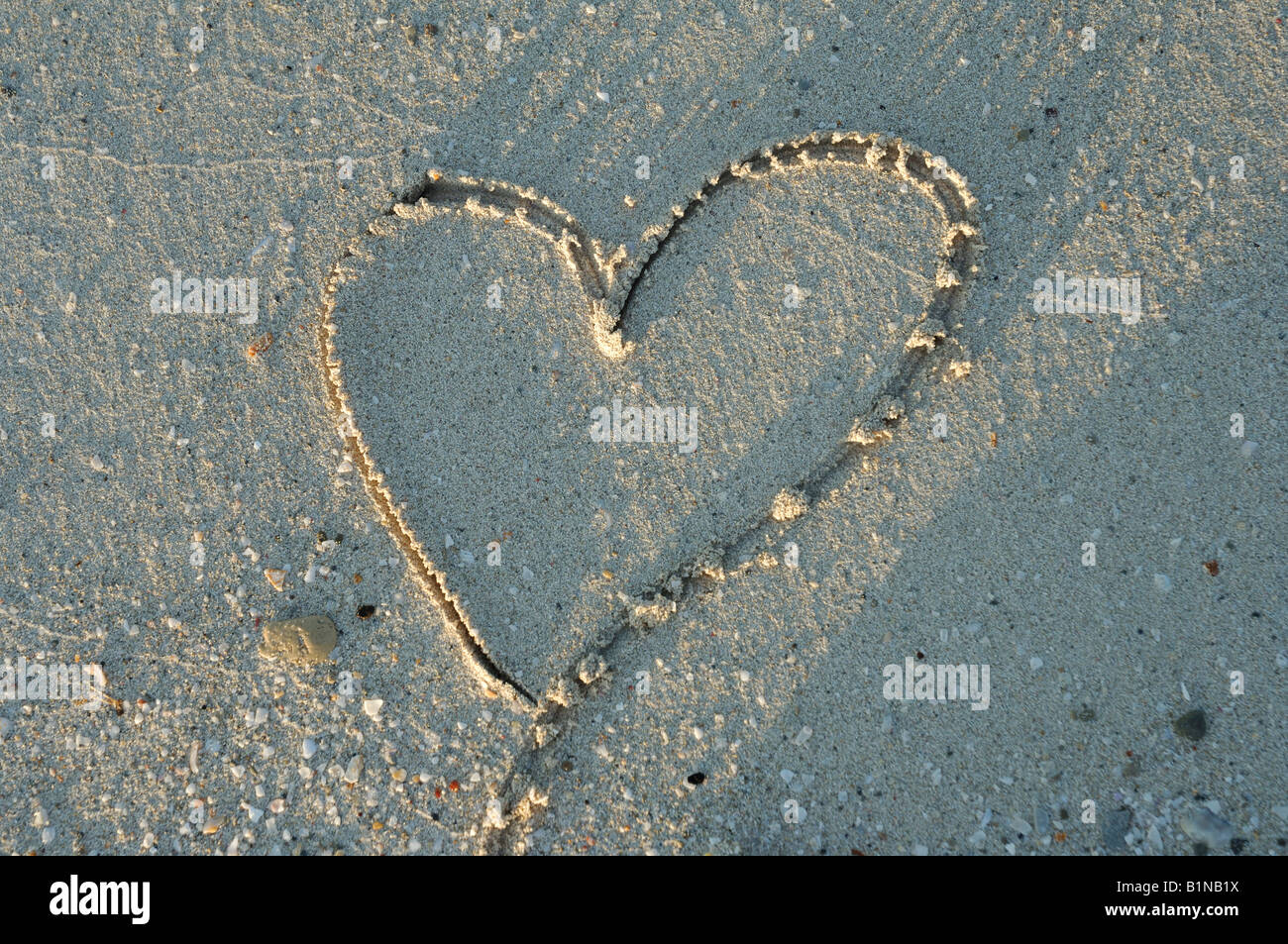 Heart in the sand Stock Photo - Alamy