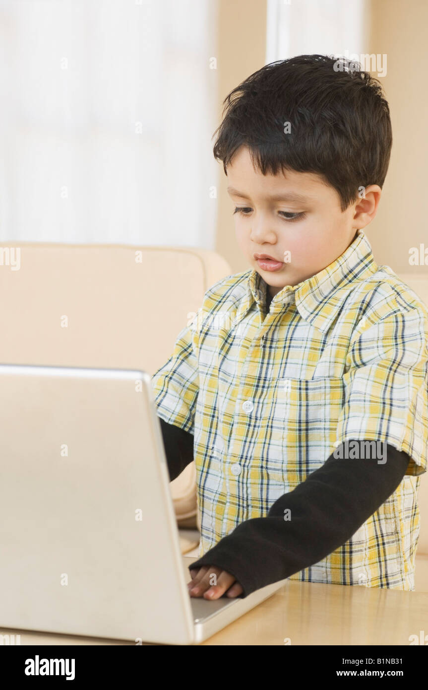 Asian boy computer laptop hi-res stock photography and images - Alamy