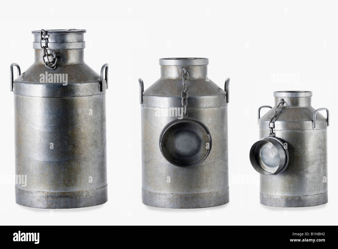 Close-up of three milk canister Stock Photo - Alamy
