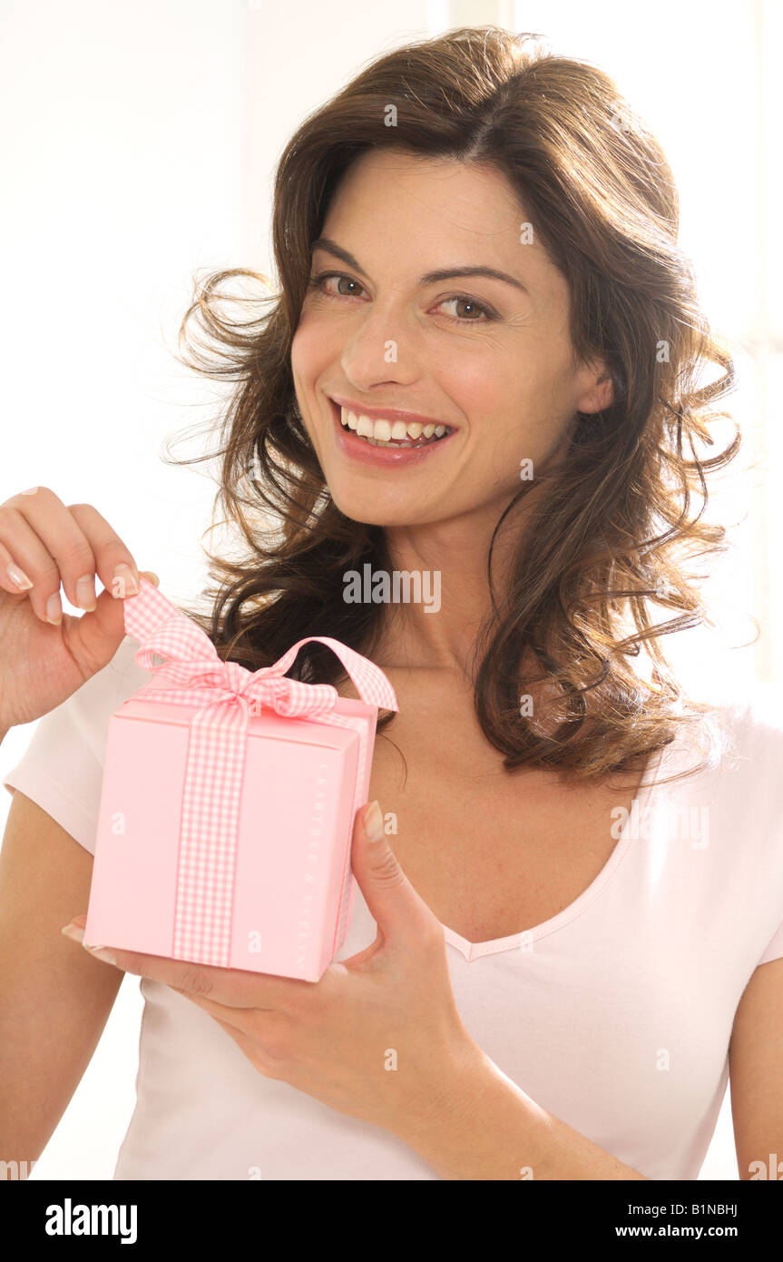 Woman with a gift Stock Photo - Alamy