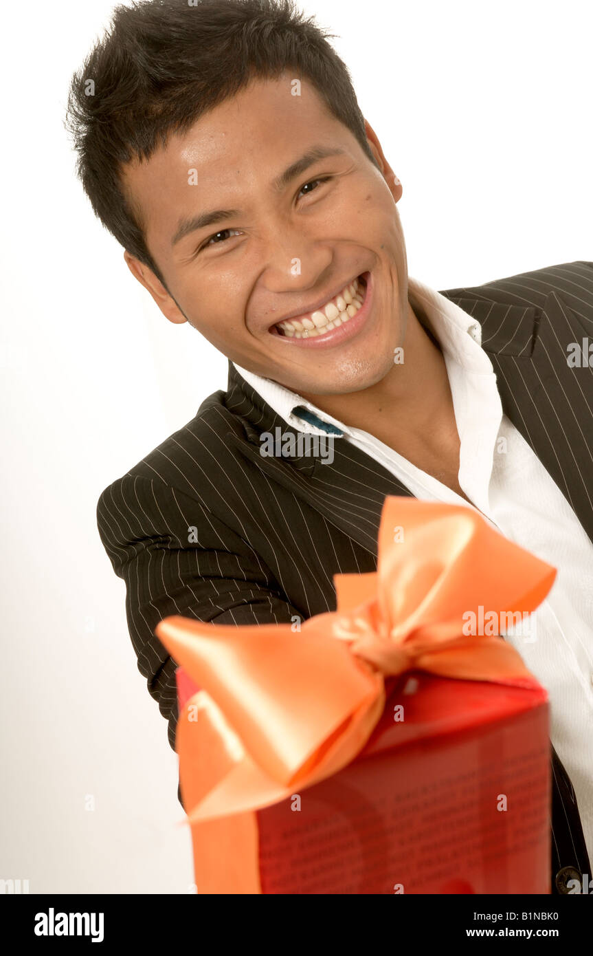 Asian man with a gift Stock Photo - Alamy