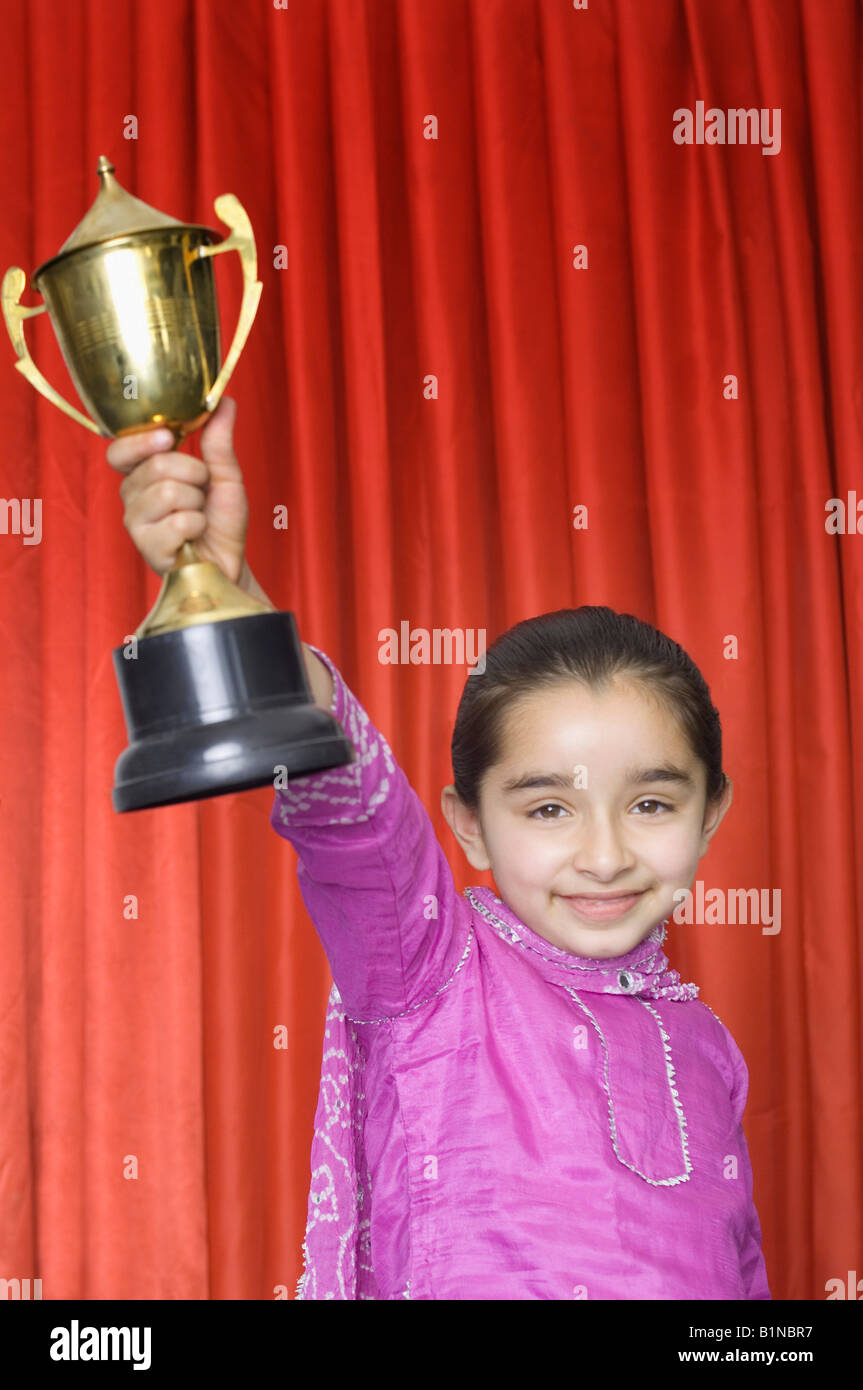 Girl winning trophy hi-res stock photography and images - Alamy
