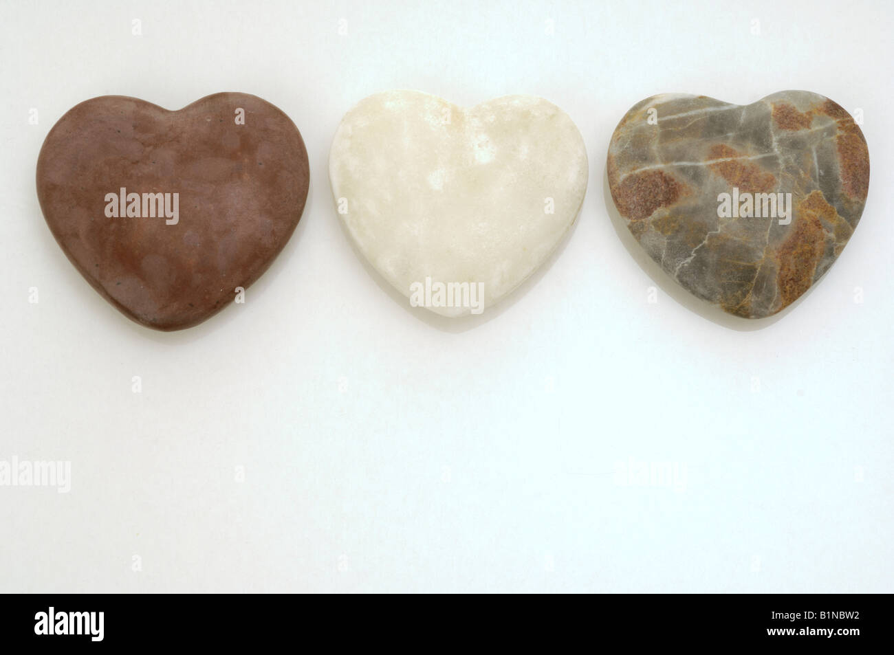 Three heartshape stones Stock Photo - Alamy
