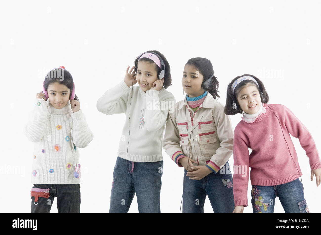 Girls listening to music Stock Photo - Alamy