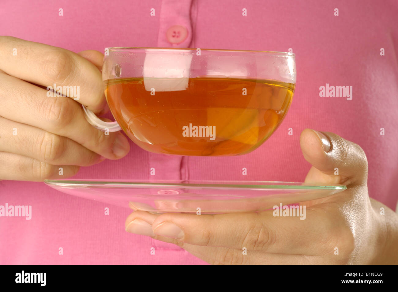 Cup of tea in a hand Stock Photo - Alamy