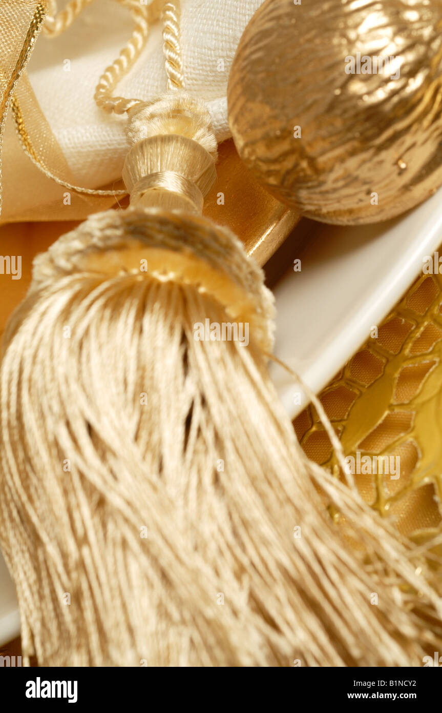Golden place setting with a tassel Stock Photo - Alamy