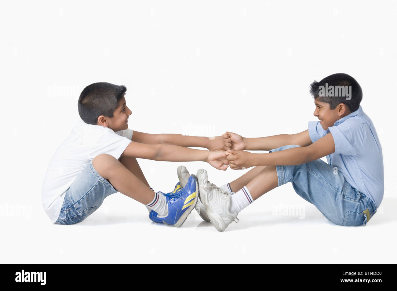 Side profile of two boys playing together Stock Photo - Alamy