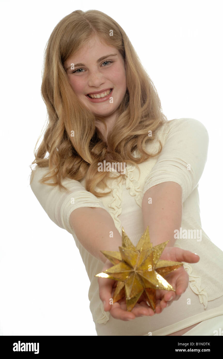 Woman holding a golden Christmas star Stock Photo - Alamy