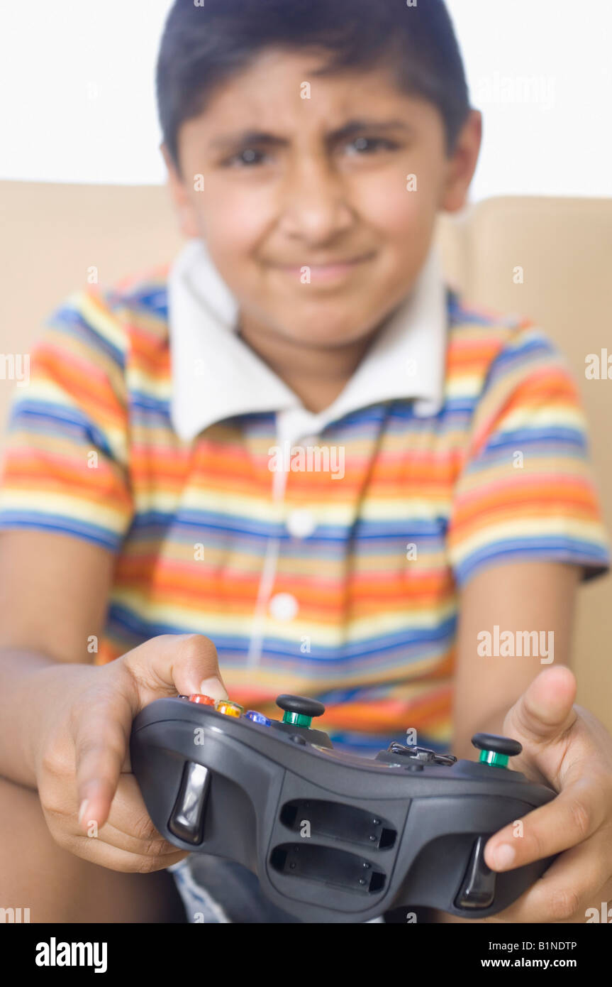 Portrait of a boy playing video game Stock Photo - Alamy