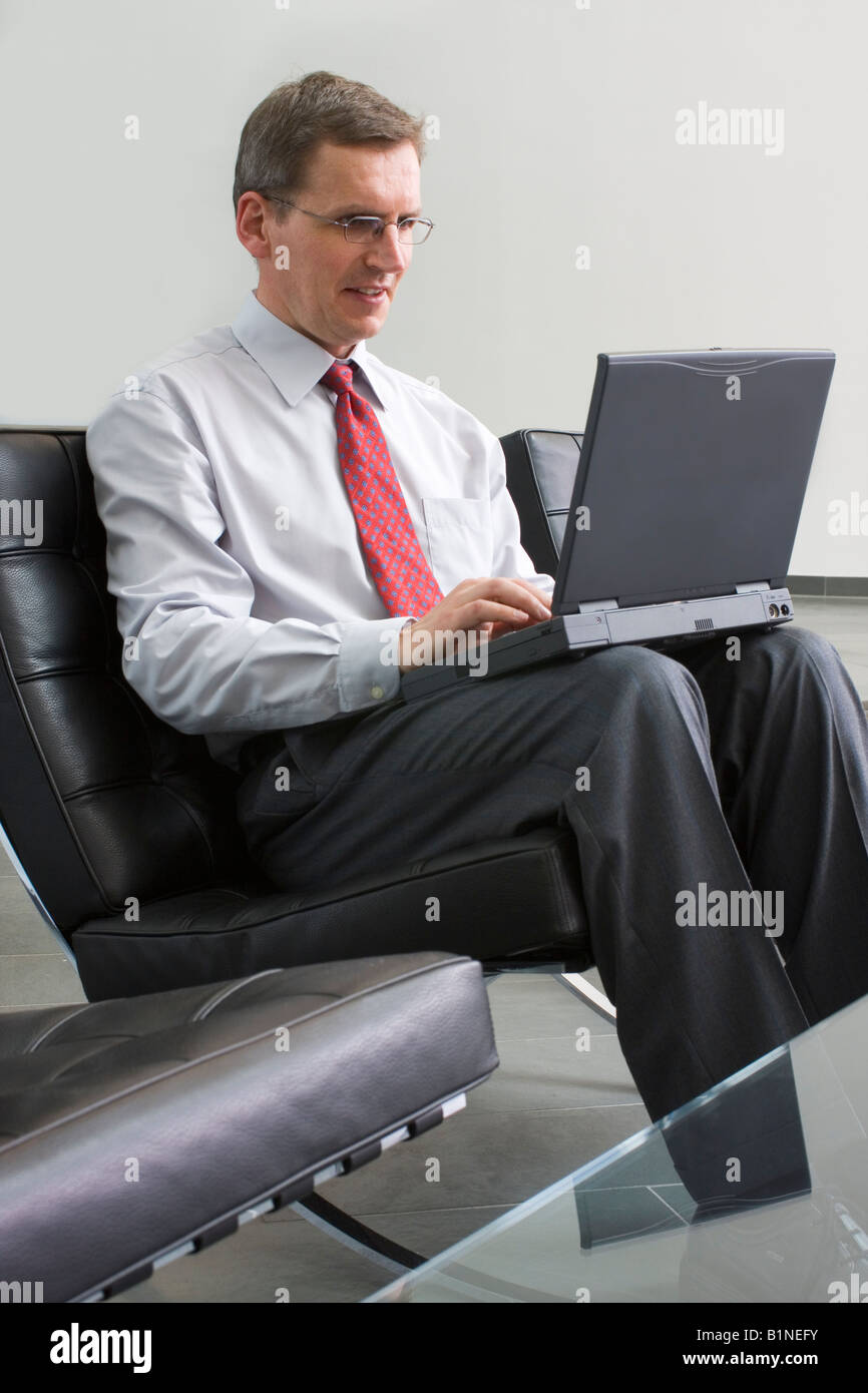 Man sitting lounge chair hi-res stock photography and images - Alamy