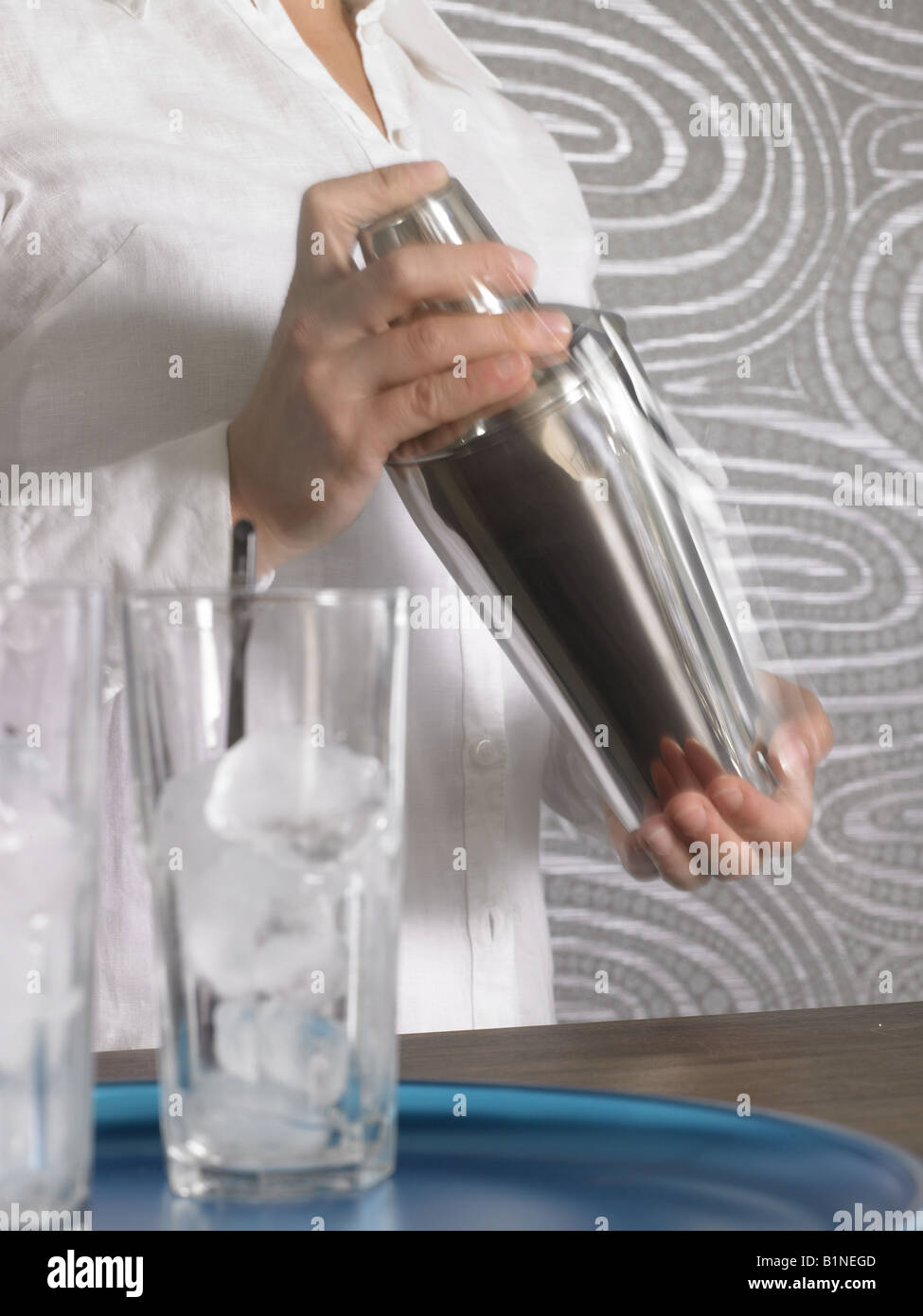 Cocktail bar and bar tender Stock Photo - Alamy