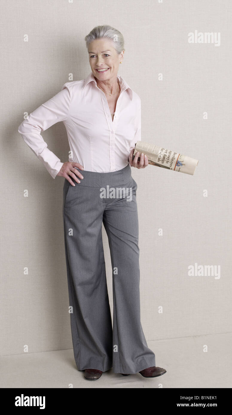 Senior adult with newspaper Stock Photo - Alamy