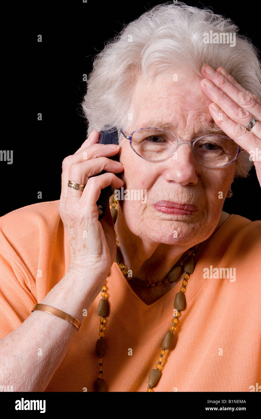 Oap using a mobile phone hi-res stock photography and images - Alamy