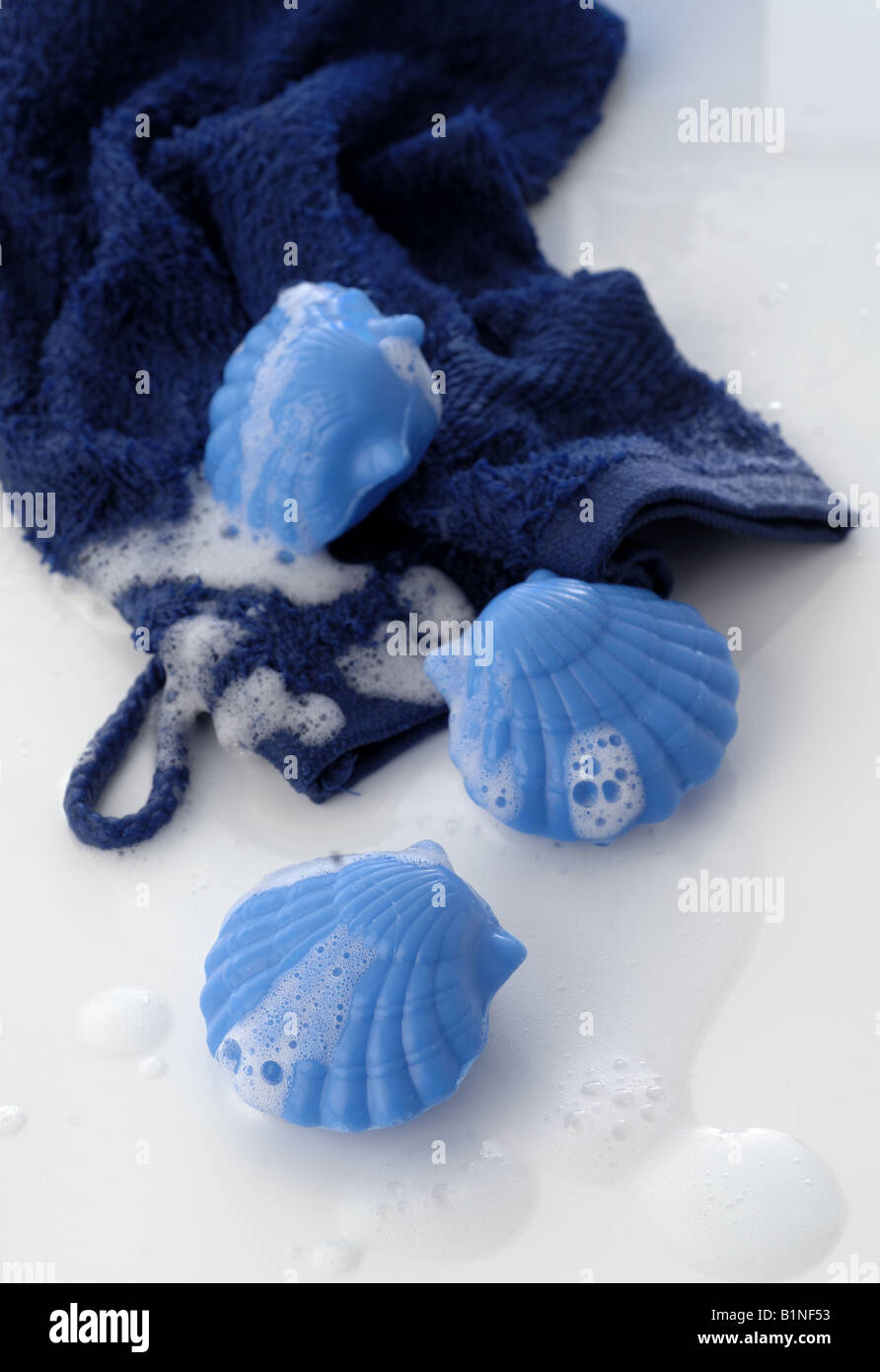 Sea shell shaped soap and towel Stock Photo - Alamy