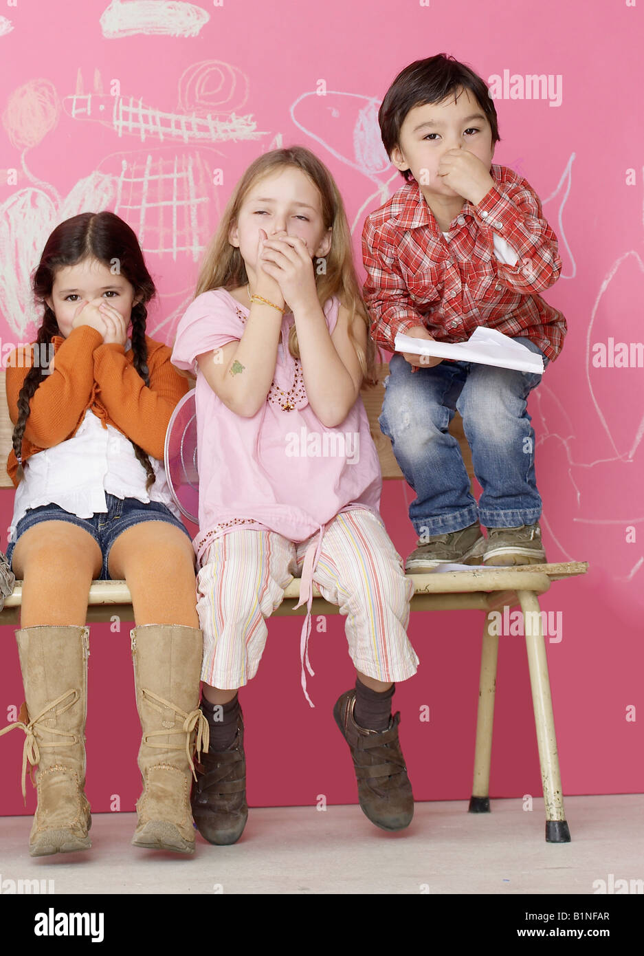 Three children keeping their noses shut Stock Photo - Alamy
