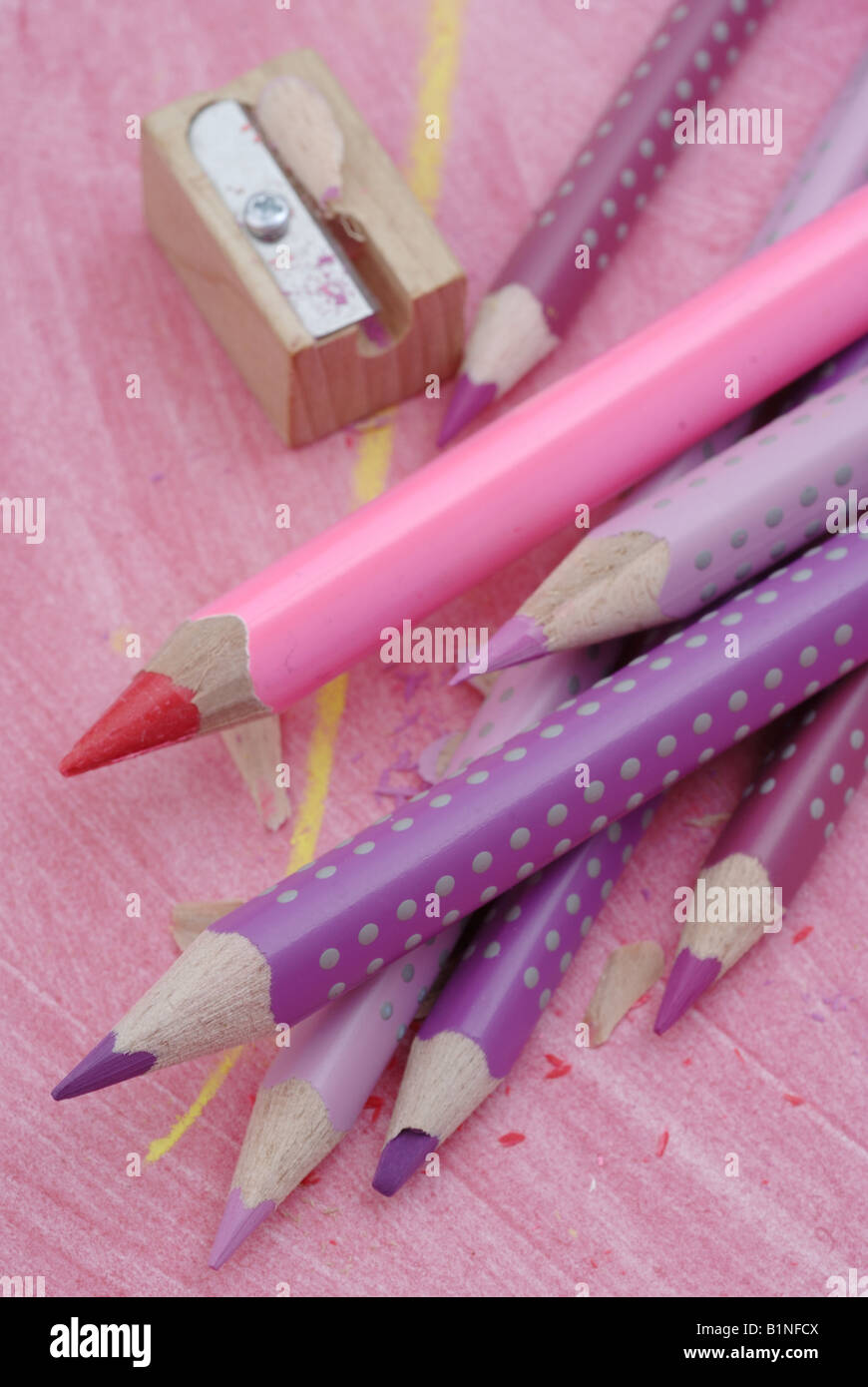Crayons and pencil sharpener Stock Photo - Alamy