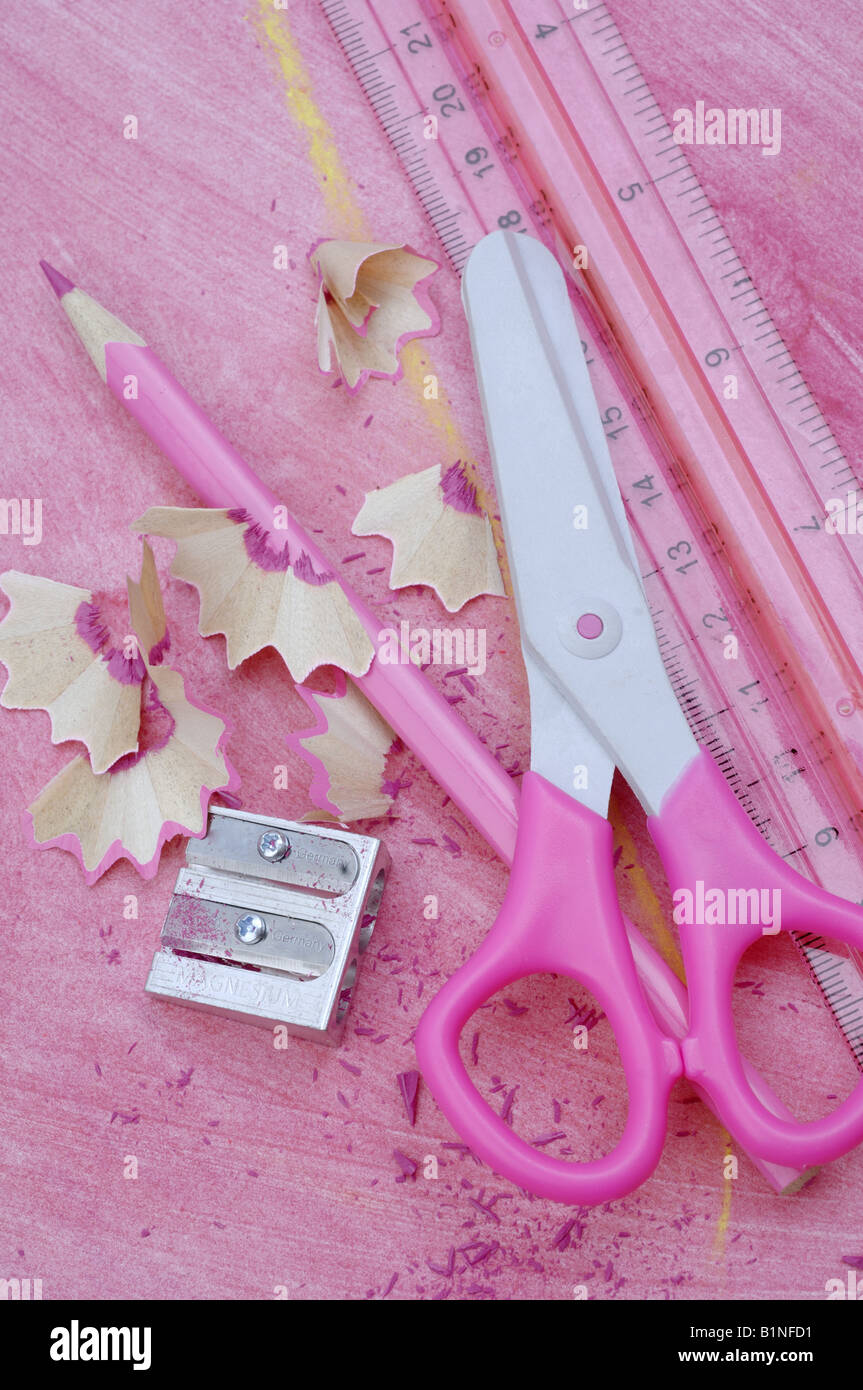 Crayon, scissors, pencil sharpener and ruler Stock Photo - Alamy