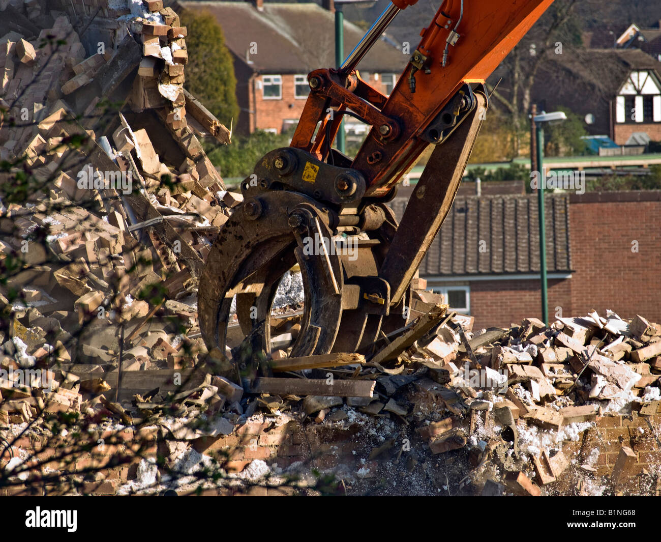Action shot of a building undergoing demolition Stock Photo - Alamy