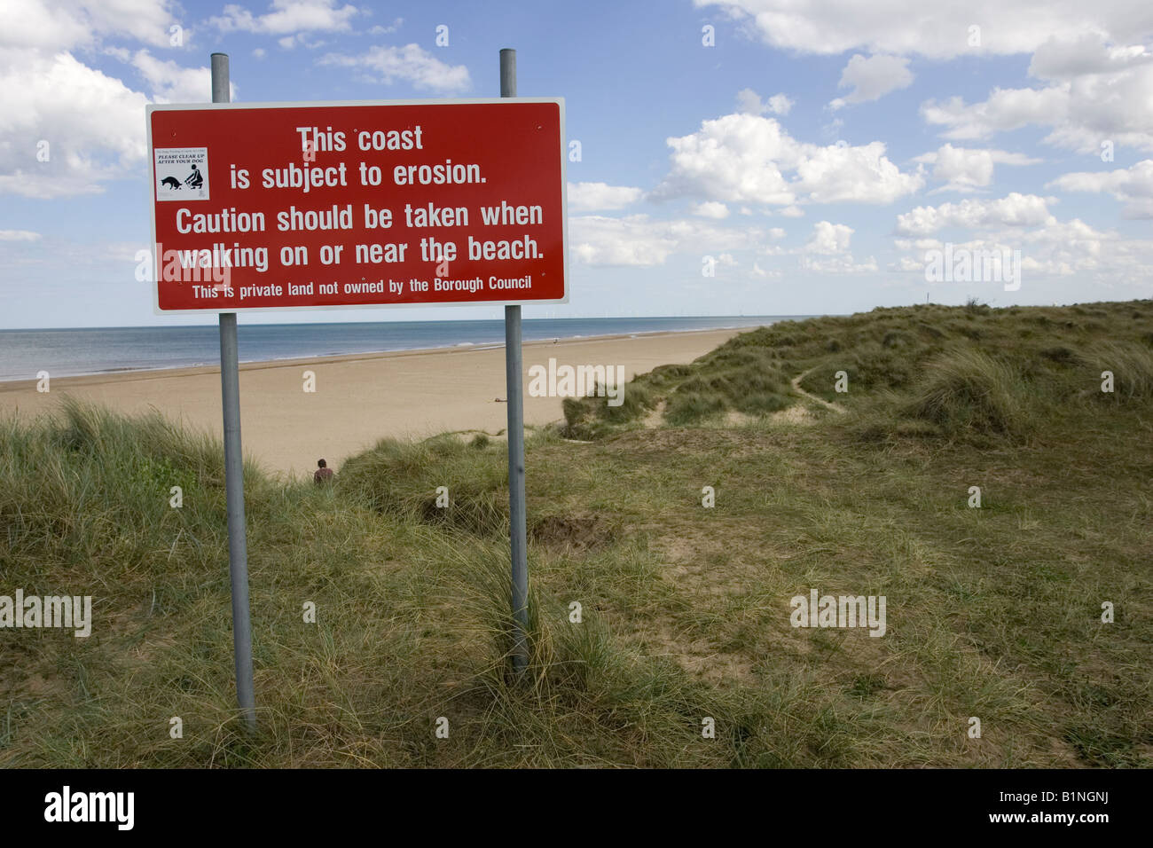 Red coastal erosion sign on sand dunes Winterton North Norfolk Coast UK ...