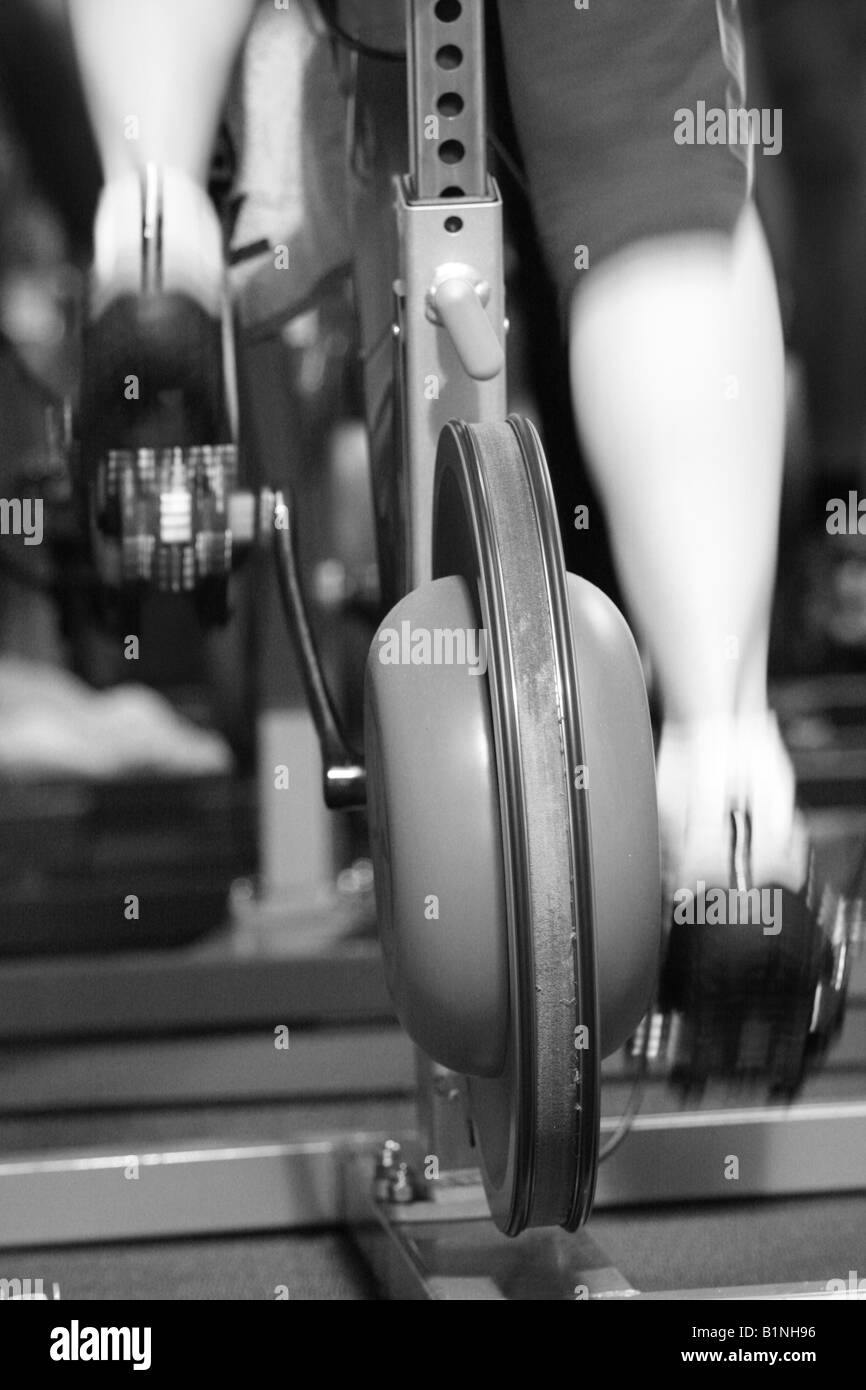 A spinning cycle class in action, below the knee movement shot of the ...