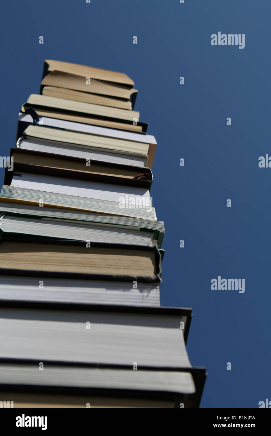 stack of books against a blue sky Stock Photo - Alamy