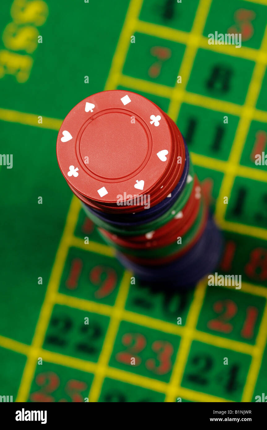 Stack of poker chips on roulette table Stock Photo - Alamy