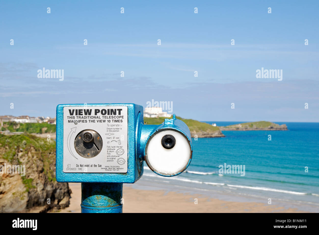 a seaside telescope overlooking the beaches at newquay in cornwall ...