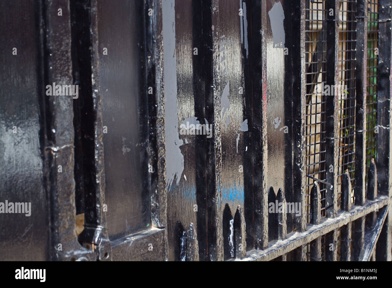 Close up of black gate outside church in Manette Street, Soho London in ...