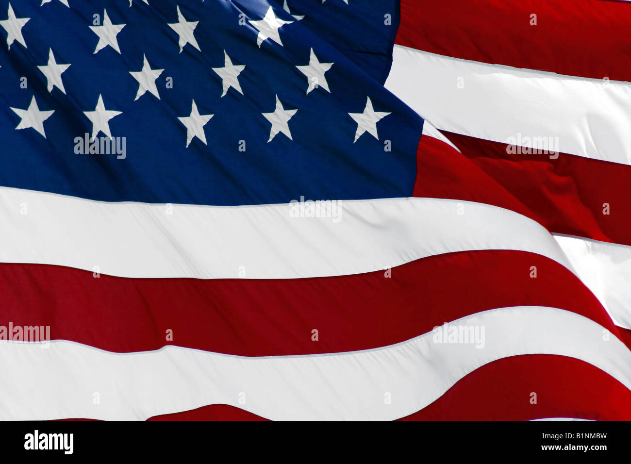 An American flag flaping boldly in the wind Stock Photo - Alamy