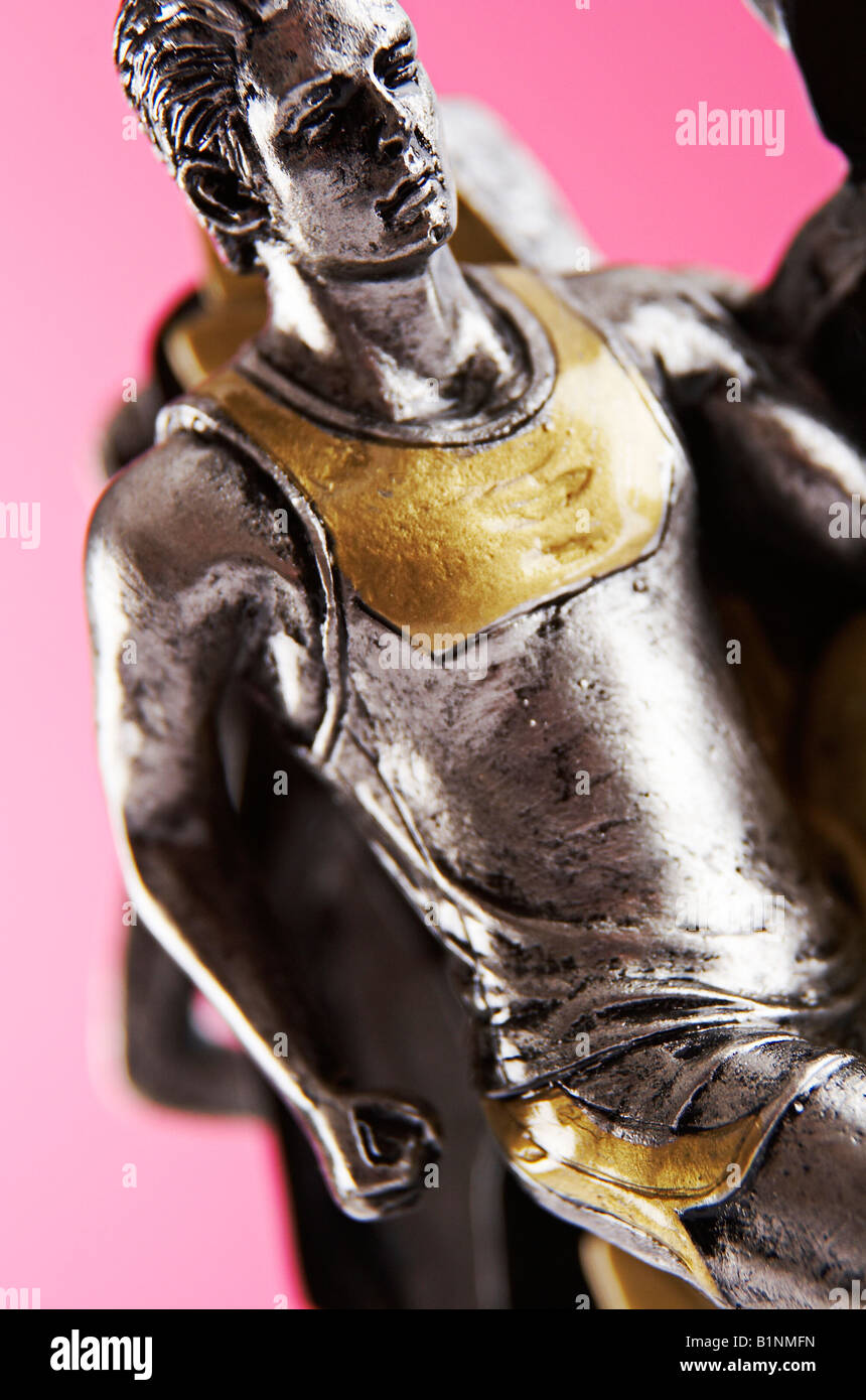 Studio shot of a running Trophy Stock Photo - Alamy