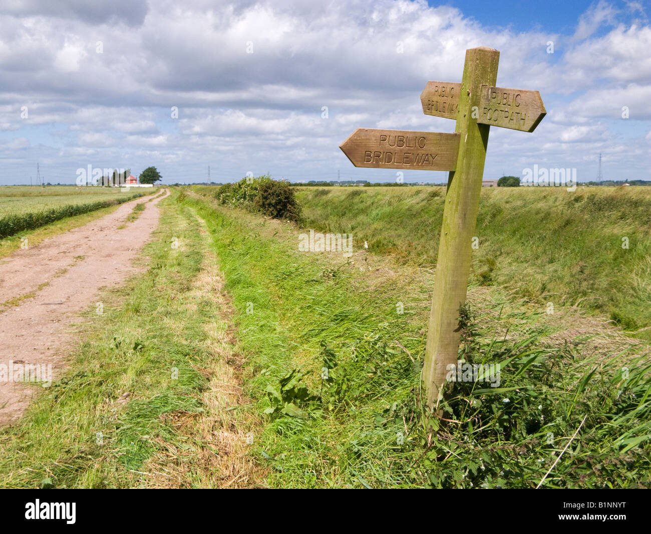 Wooden sign post indicating public footpath and bridleways in the ...