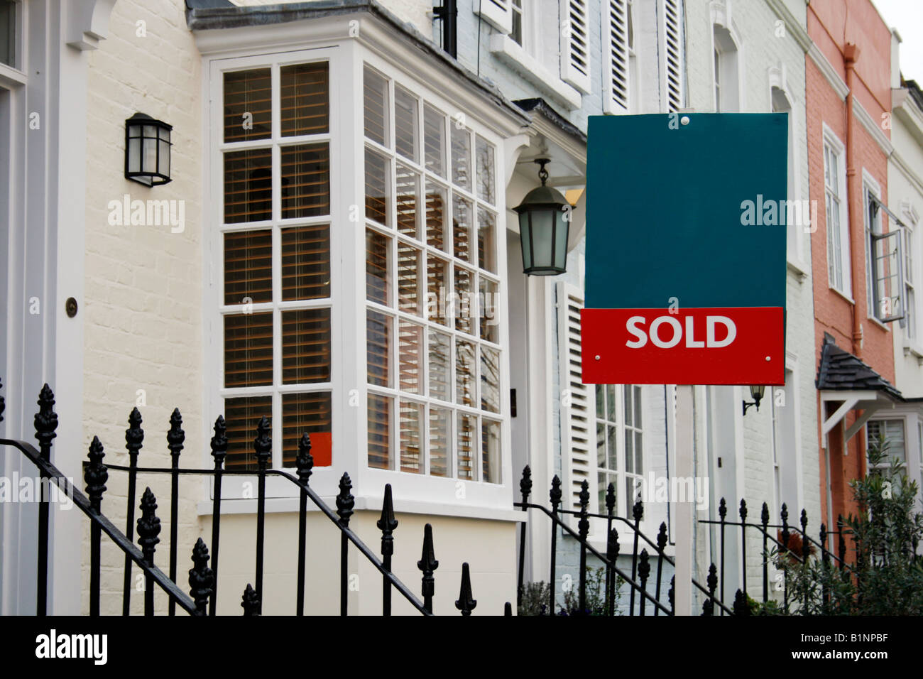 English white georgian house in London with sold sign Stock Photo - Alamy
