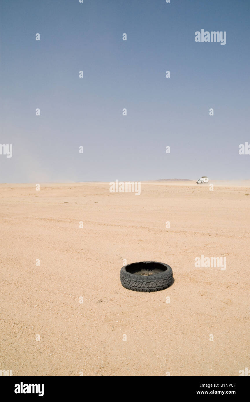 Broken tire in desert Stock Photo - Alamy